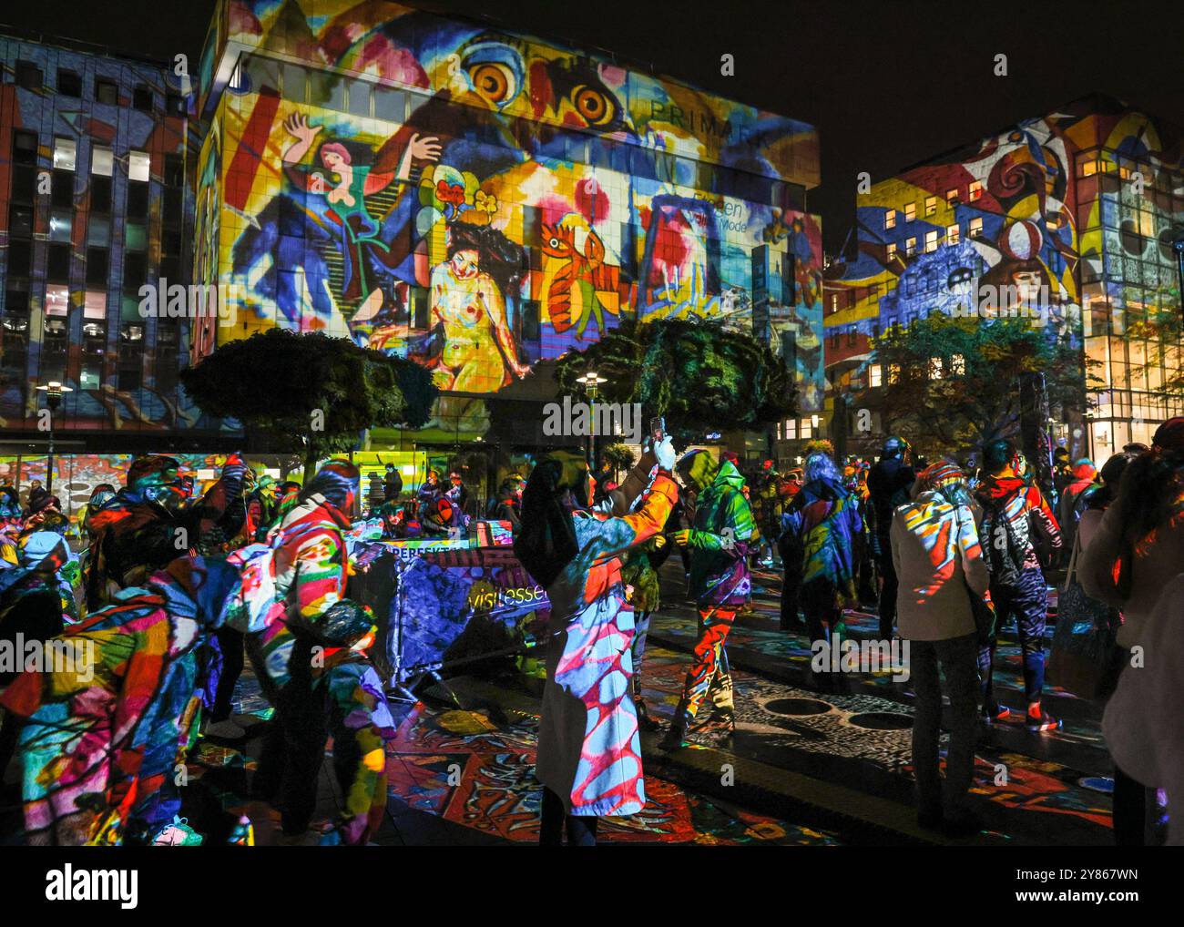 Essen, NRW, Germany. 02nd Oct, 2024. Visitors interact with collaged ...