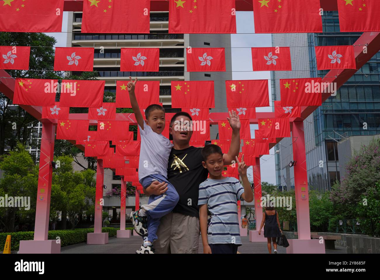 Mainland Chinese tourists pose for photos at a park with Chinese ...