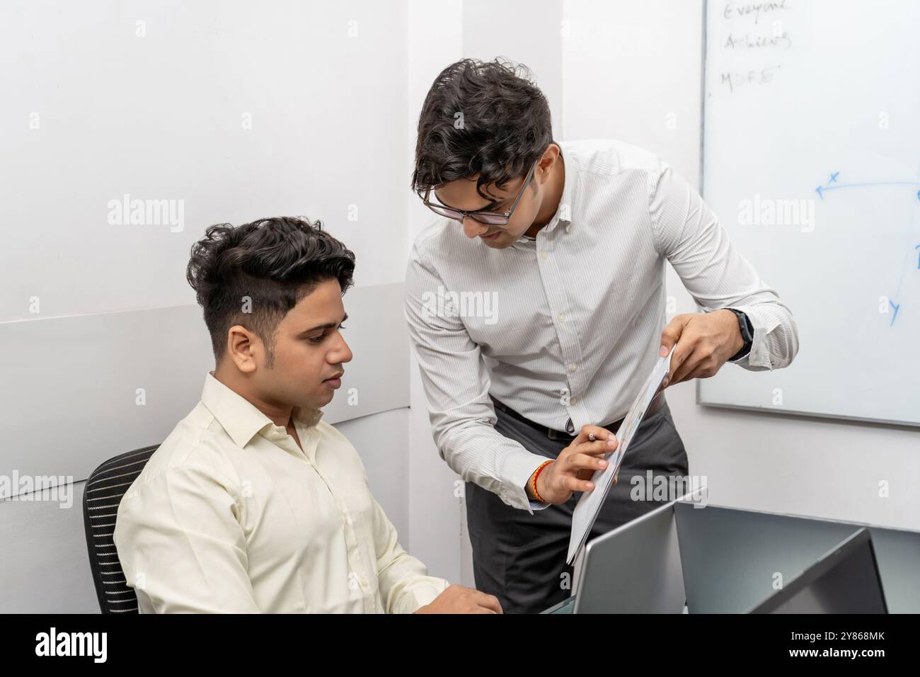 Diverse business partners sign a contract after successful negotiations ...