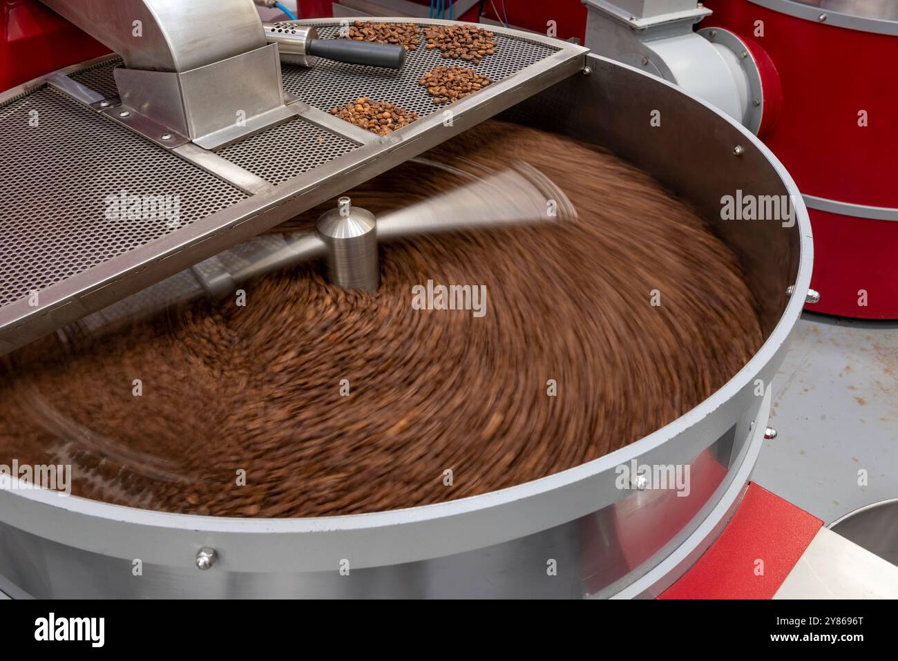 The process of roasting a batch of high quality organic coffee beans in ...