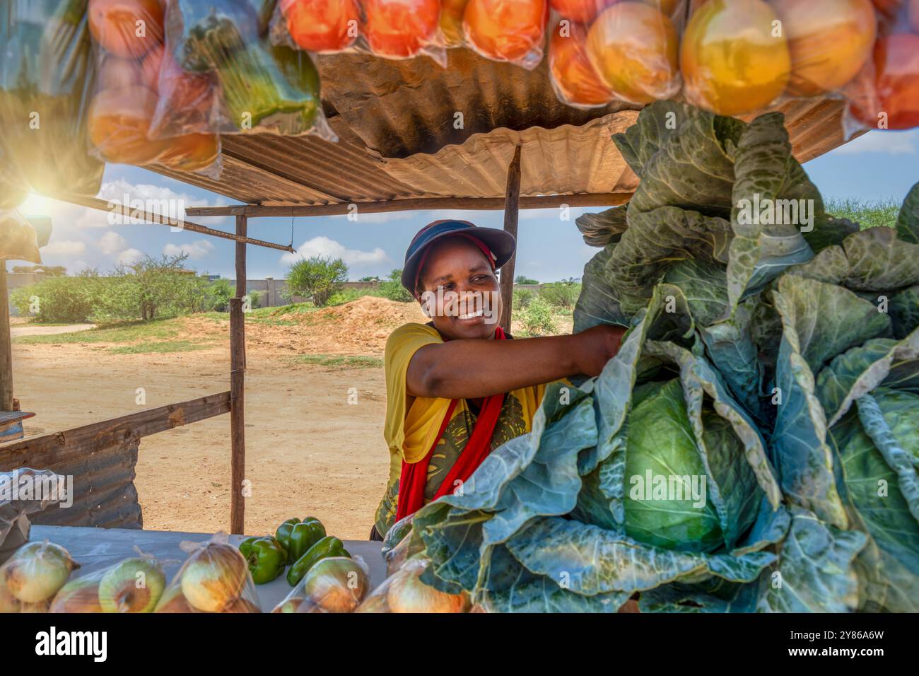 african woman vegetable street vendor, smiling self employed at her ...