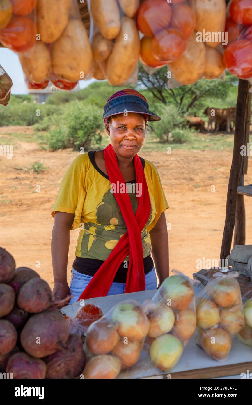 african woman vegetable street vendor, smiling self employed at her ...