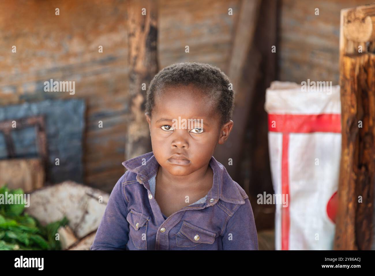 village african orphan child portrait with an expressive face, poverty ...