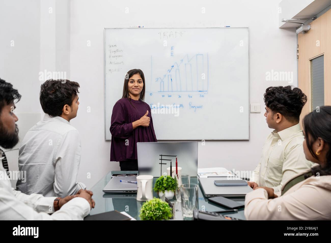 Confident businesswoman in a boardroom meeting representing women's ...