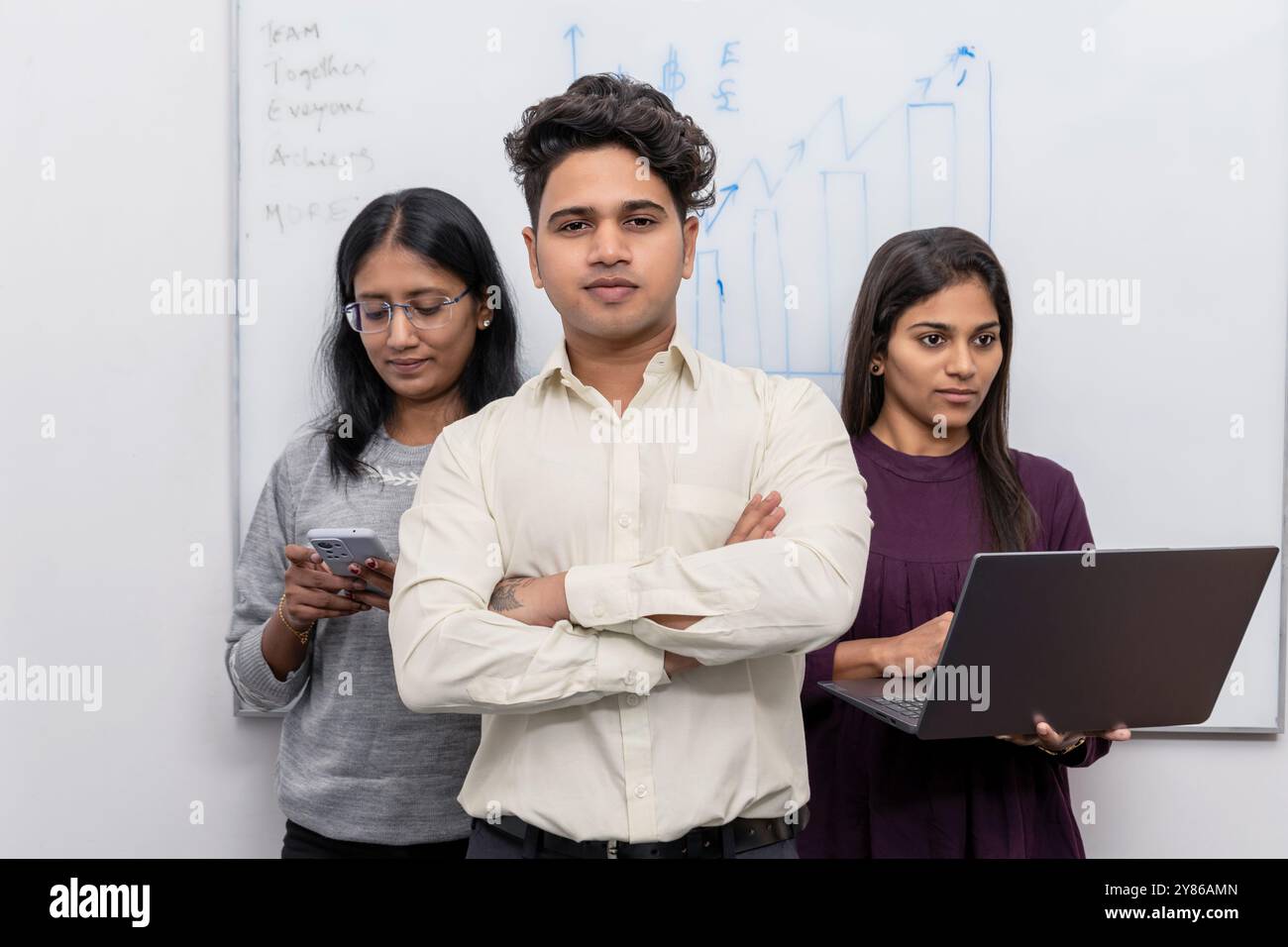 A professional business team of three, featuring a confident team ...