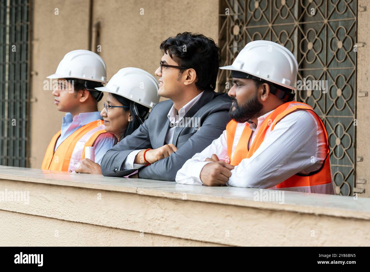 Reputed trustworthy Engineering firm, a reliable construction team proudly celebrating at the ...