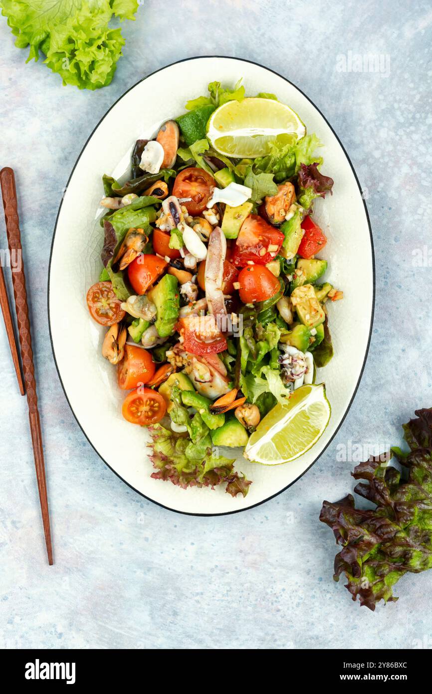 Salad with calamari, shrimp, clams and fresh vegetables Stock Photo - Alamy