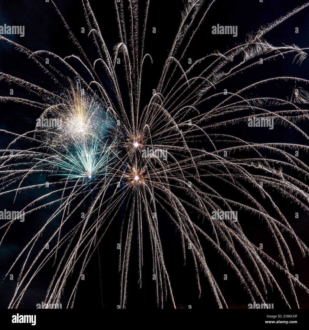 Bursting fireworks at a Bonfire Night display on the fifth of November ...