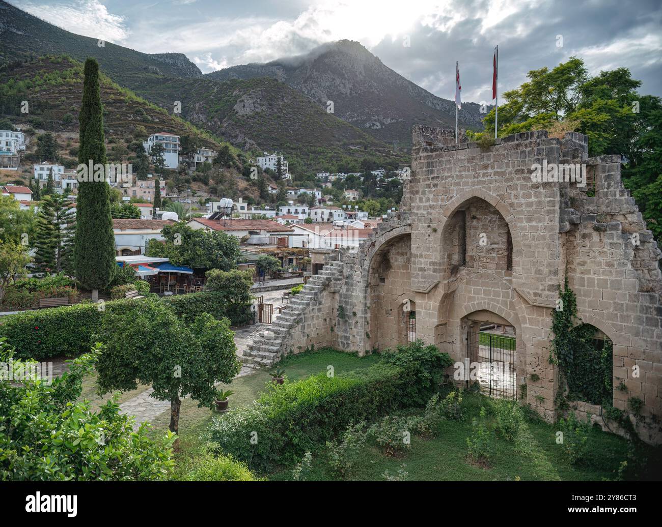 Medieval Bellapais Abbey ruins towering over picturesque Bellapais ...