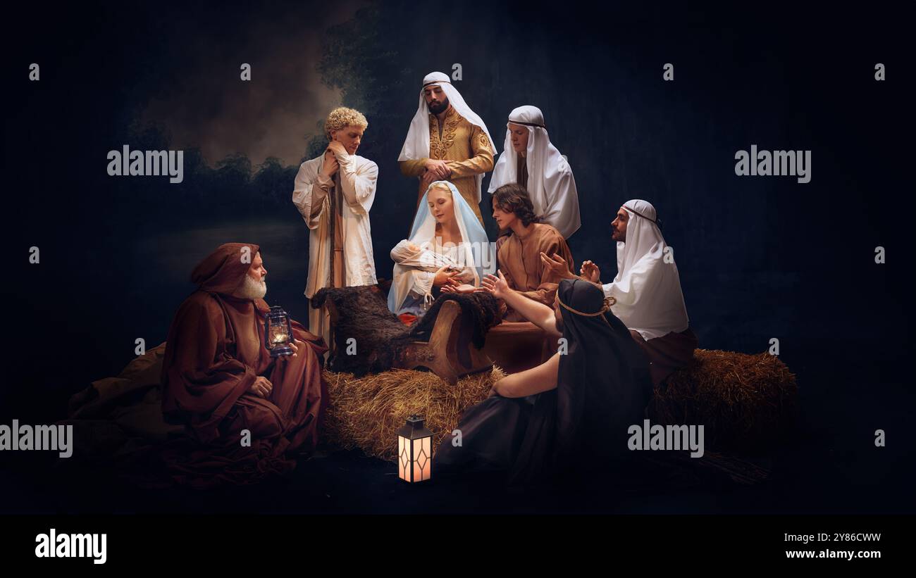 Nativity setup with newborn child, Jesus, cradled by Mary. Shepherd ...