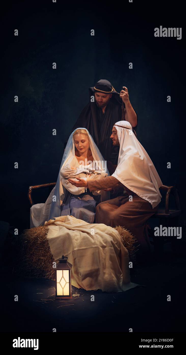 Holy and magical nativity scene with Mary gently holding baby Jesus ...