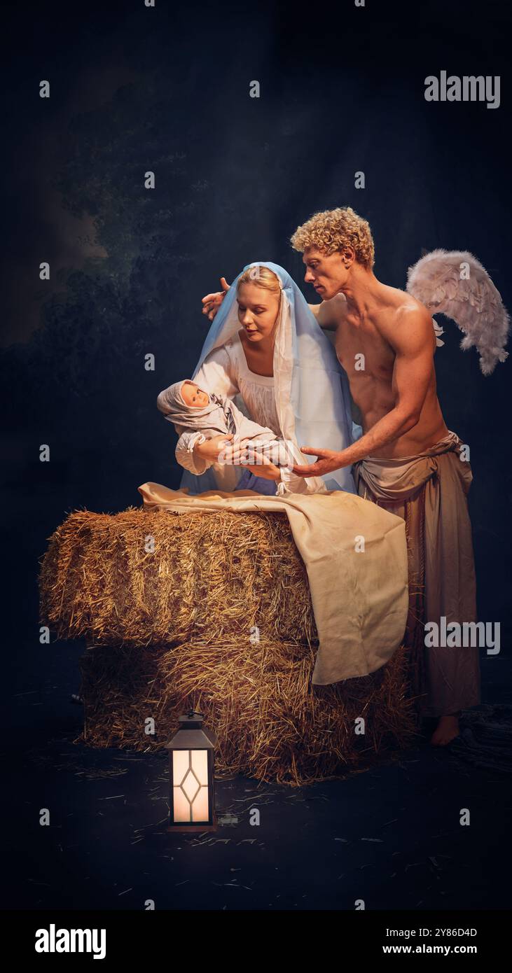 Christmas scene with baby Jesus in a manger, with Mary and angel ...