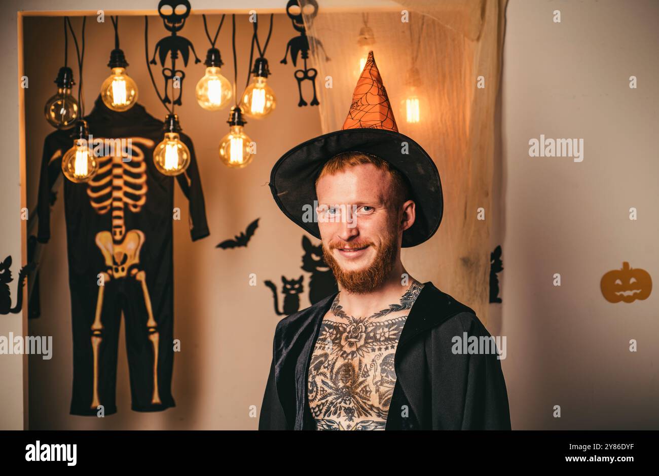 Scary face man with horror Make up holding Pumpkin head jack lantern on ...