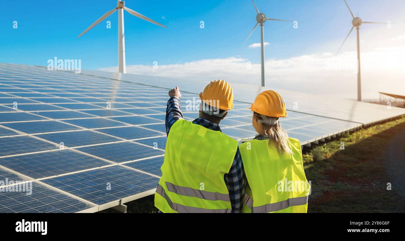 People working for alternative energy farm - Wind turbine power ...