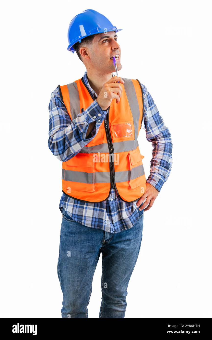 vertical pensive construction worker dressed in an orange safety vest ...