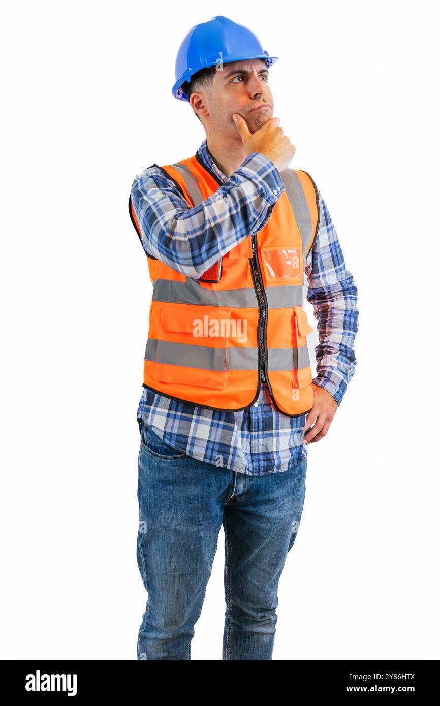 vertical pensive construction worker dressed in an orange safety vest ...