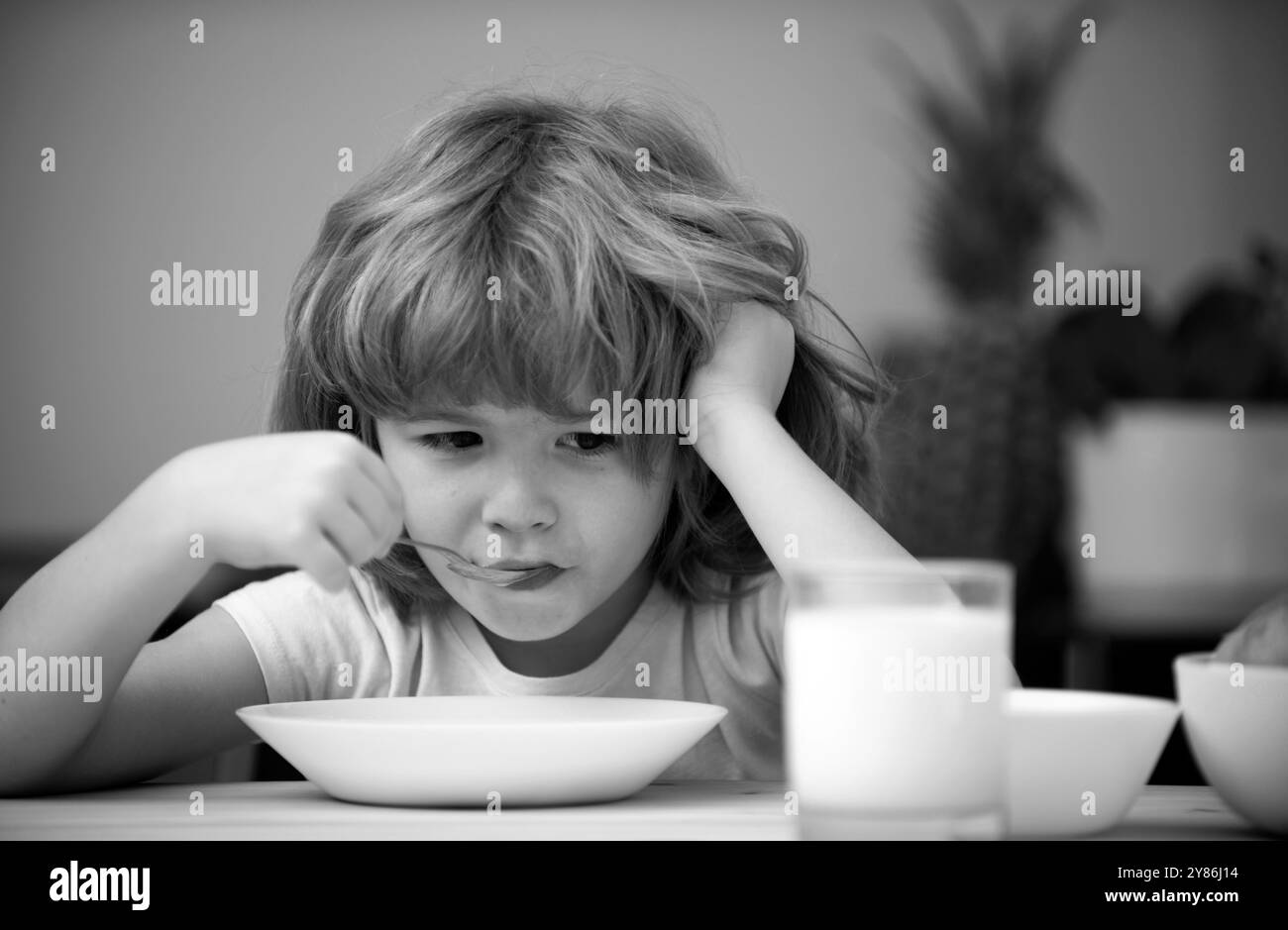 Child dinner. Portrait of fun kid having healthy tasty snack. Small kid ...