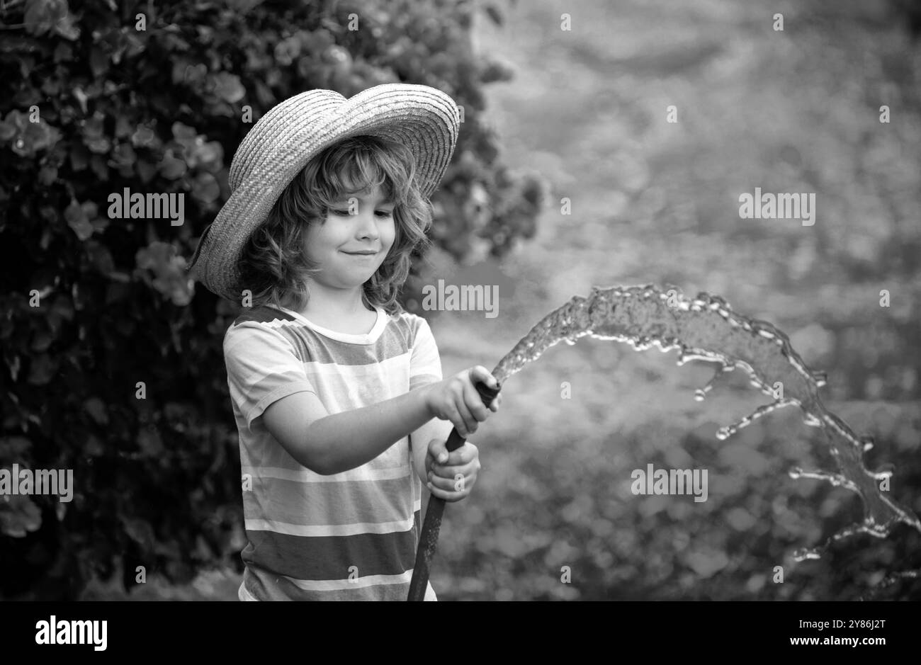 Kids play with water garden hose in yard. Outdoor children summer fun ...