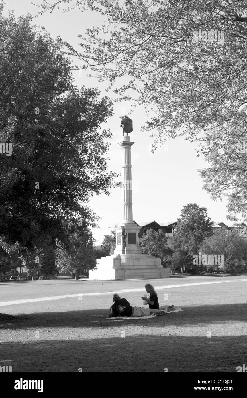 Young Caucasian couple relaxing by Calhoun Monument at Marion Square in ...