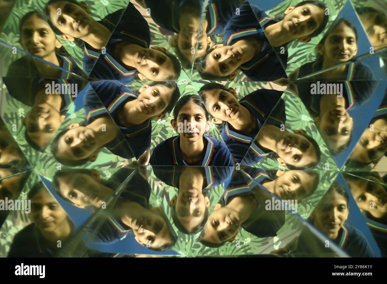 Mumbai, Maharashtra, India. 3rd Oct, 2024. A staff peeks through a ...