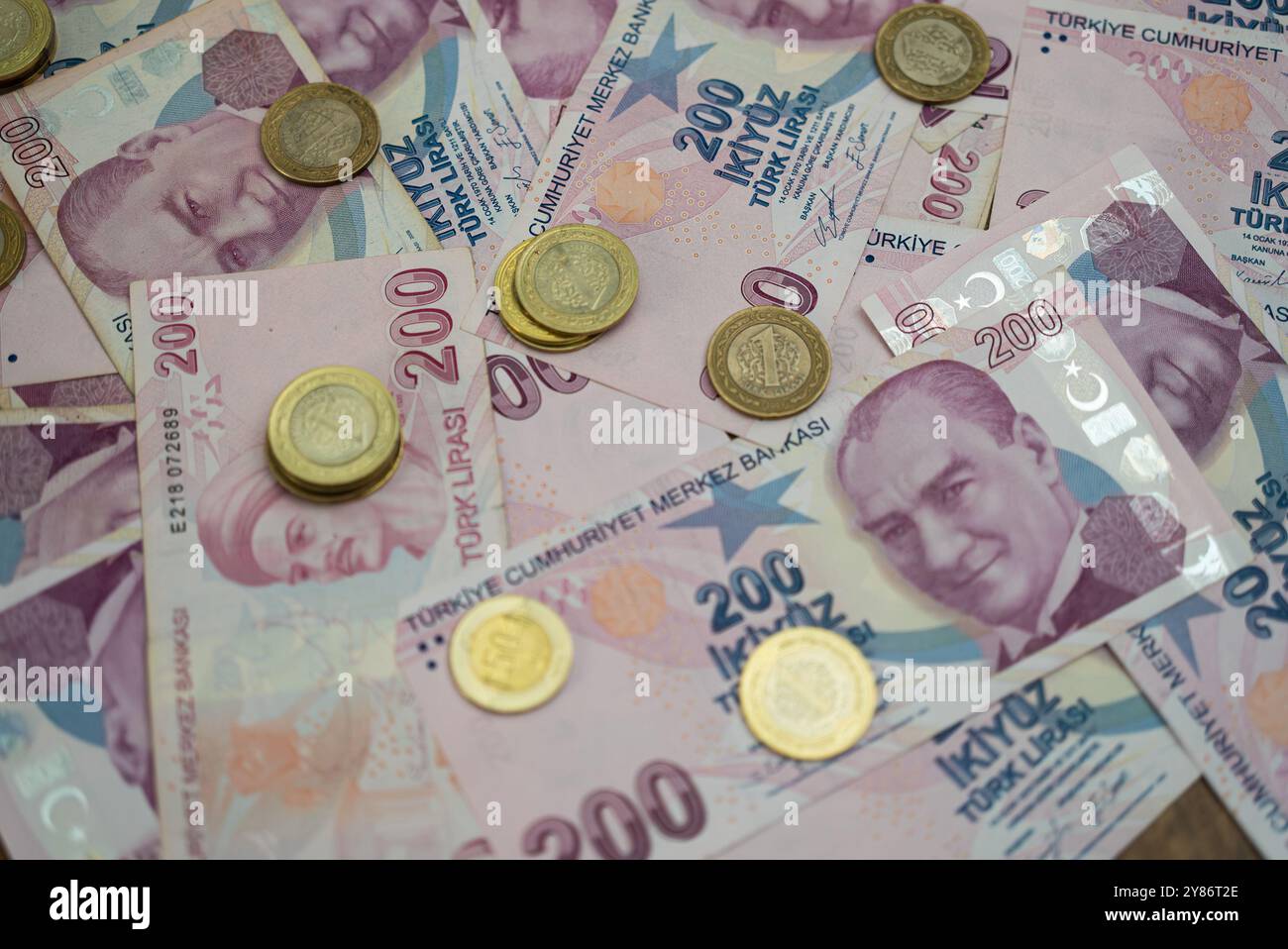 Turkish lira banknotes and coins scattered on a surface. Currency ...