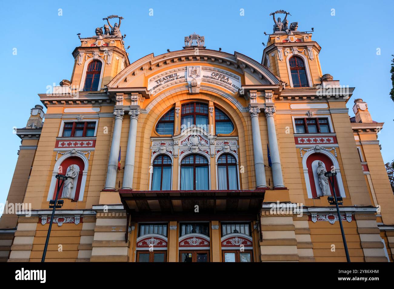 The Romanian National Theatre and Opera House lit by evening sunshine ...