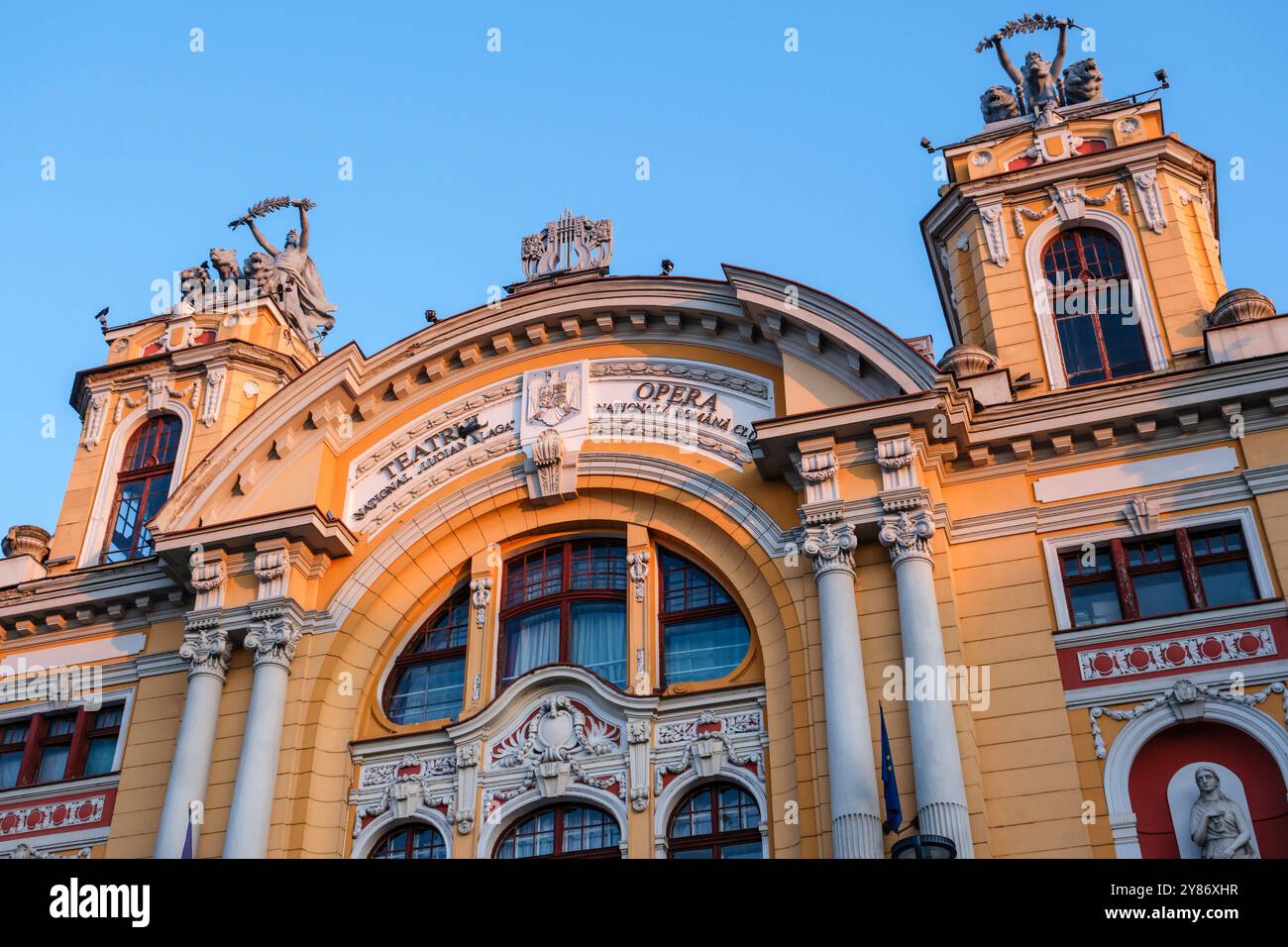 The Romanian National Theatre and Opera House lit by evening sunshine ...