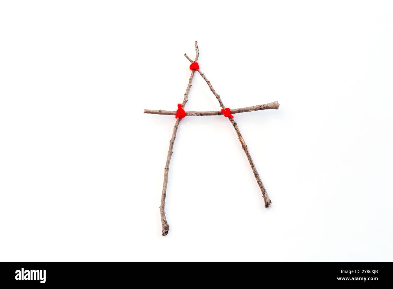 tie two twigs together at the end, spread them a little and tie a third ...