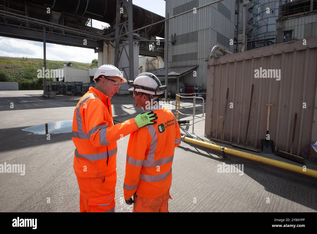 Workers at the cement production facility at Heidelberg Materials ...