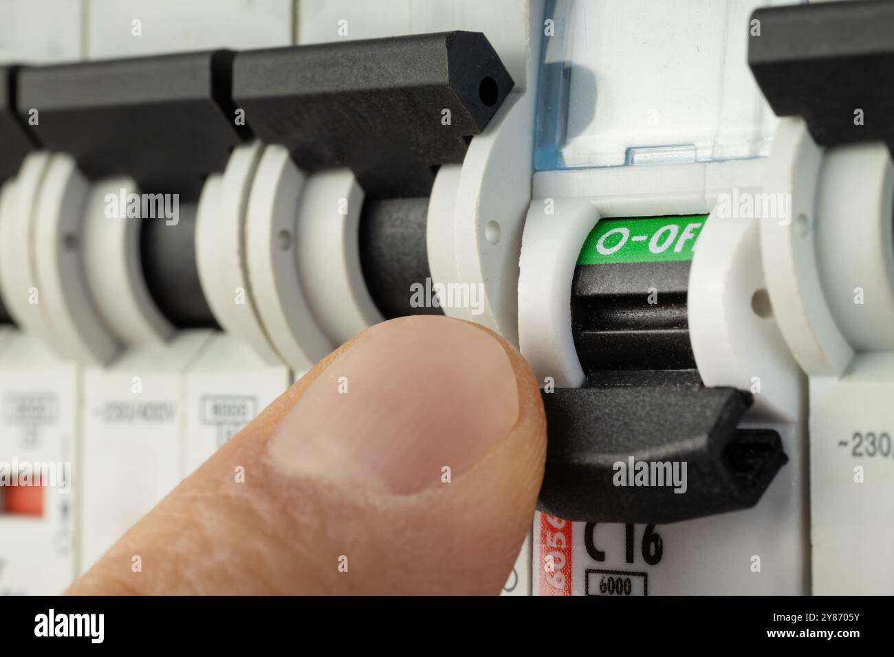 Hand flipping electrical switch in breaker panel Stock Photo - Alamy