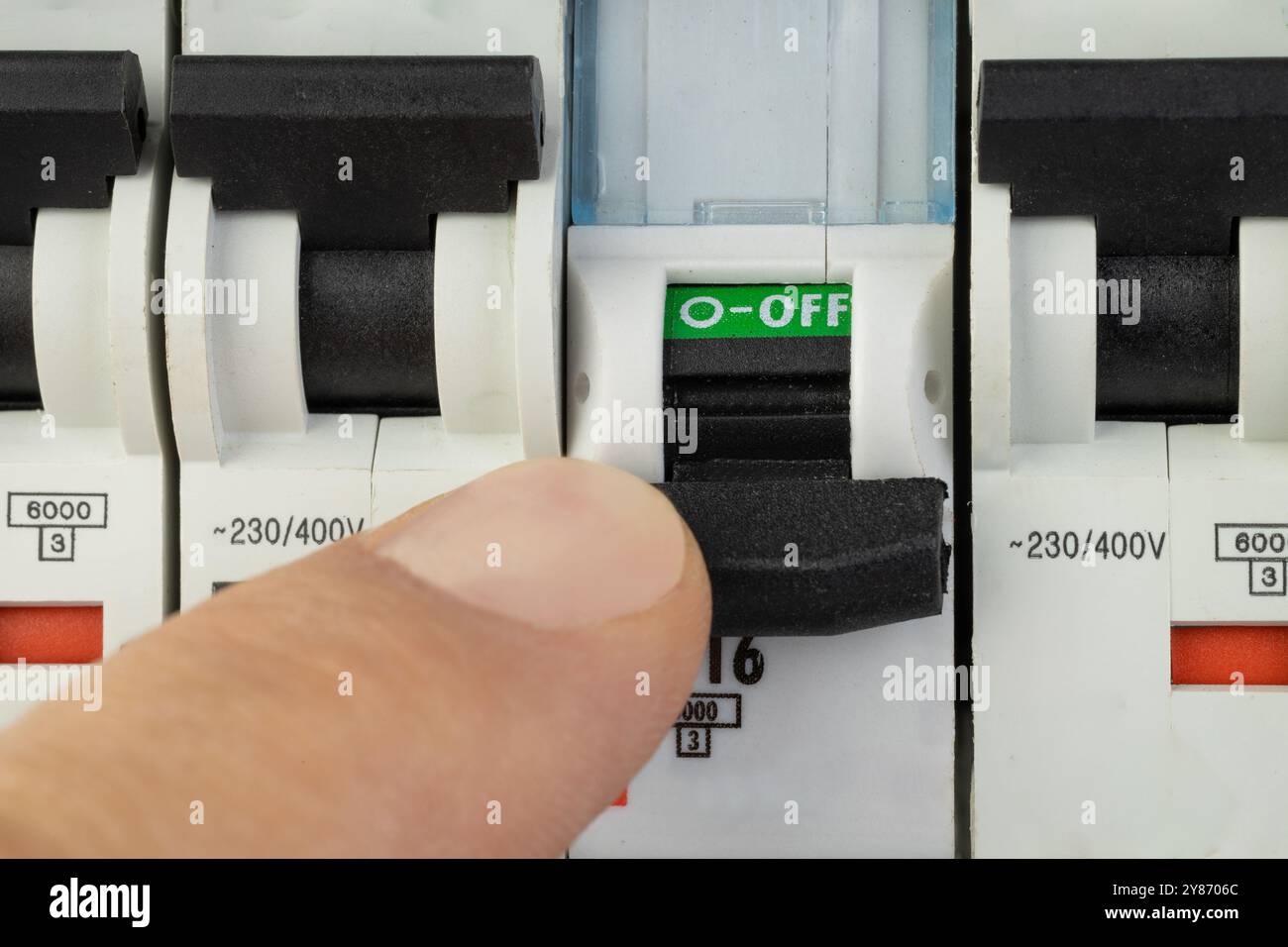 Hand turning off electrical circuit breaker in control panel Stock ...