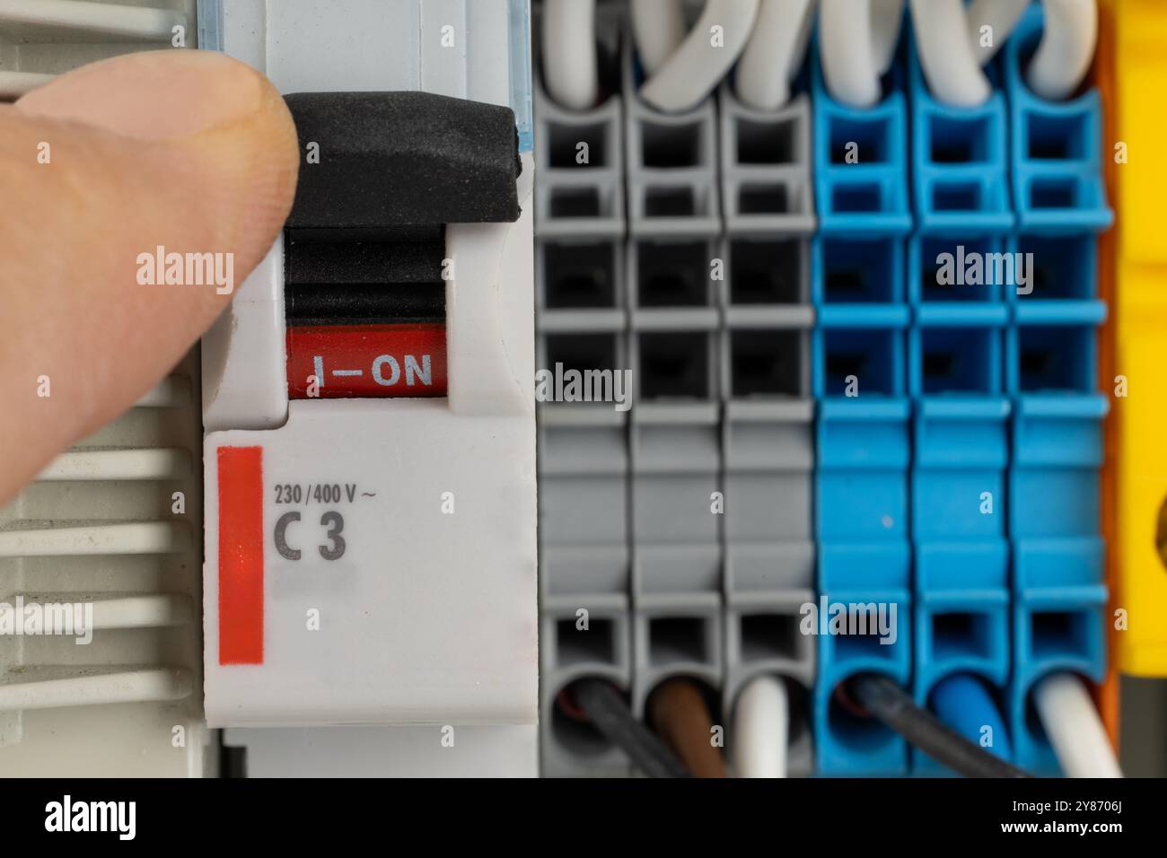 Switching on electrical circuit breaker in control panel Stock Photo ...
