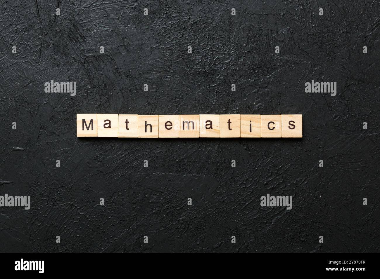 mathematics word written on wood block. mathematics text on cement ...