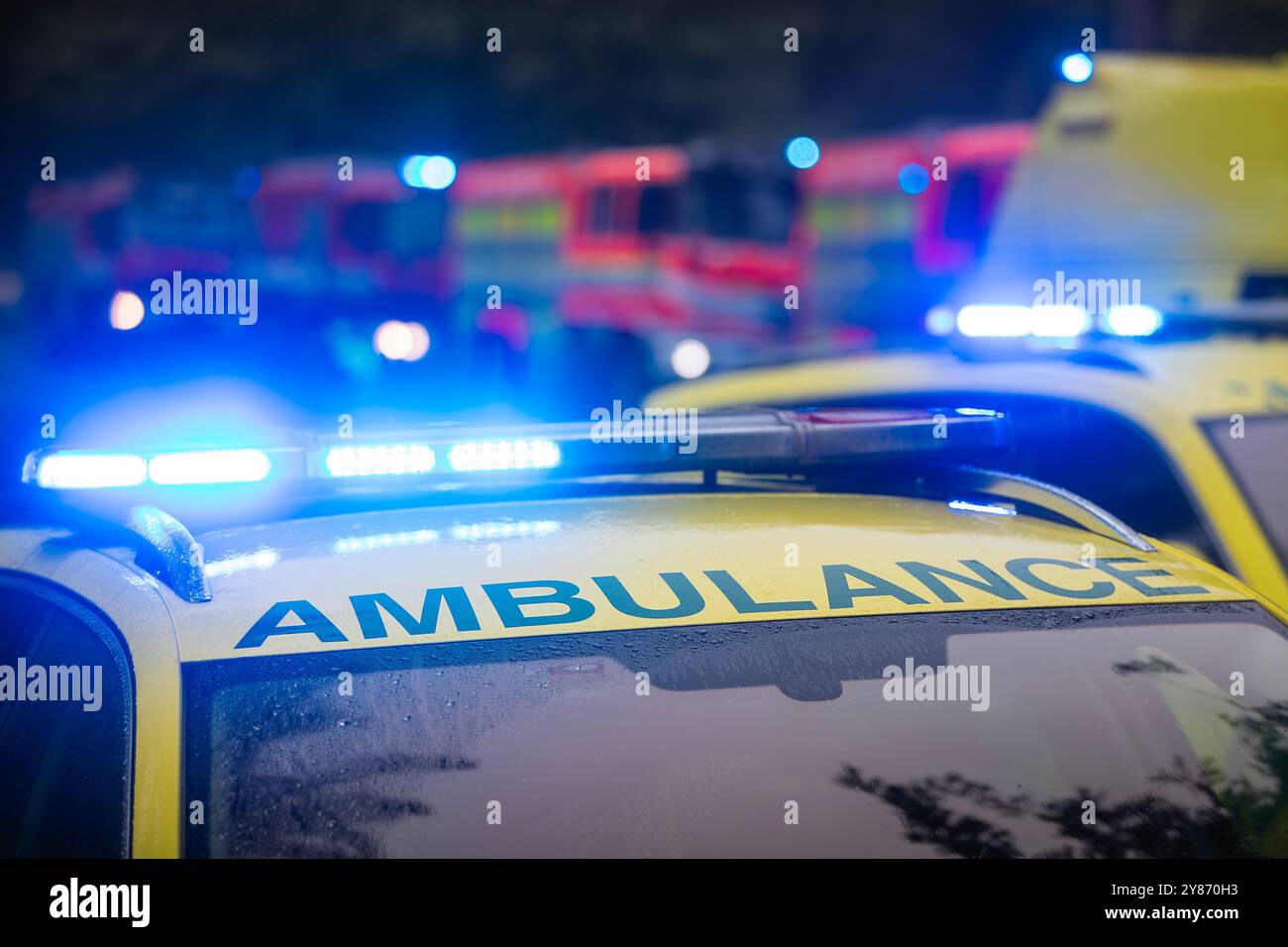 Close-up of blue light flasher on roof of ambulance car of emergency ...
