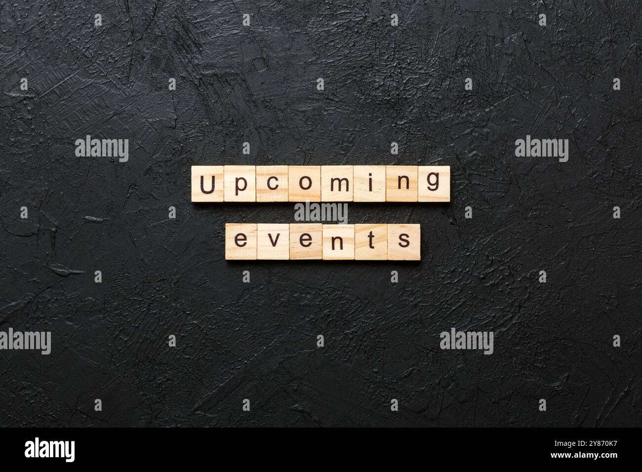 upcoming evente word written on wood block. upcoming evente text on ...