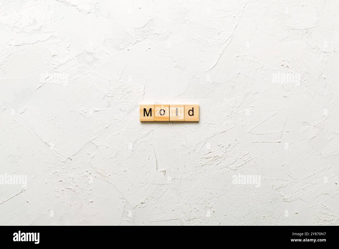 Mold word written on wood block. Mold text on table, concept Stock Photo - Alamy