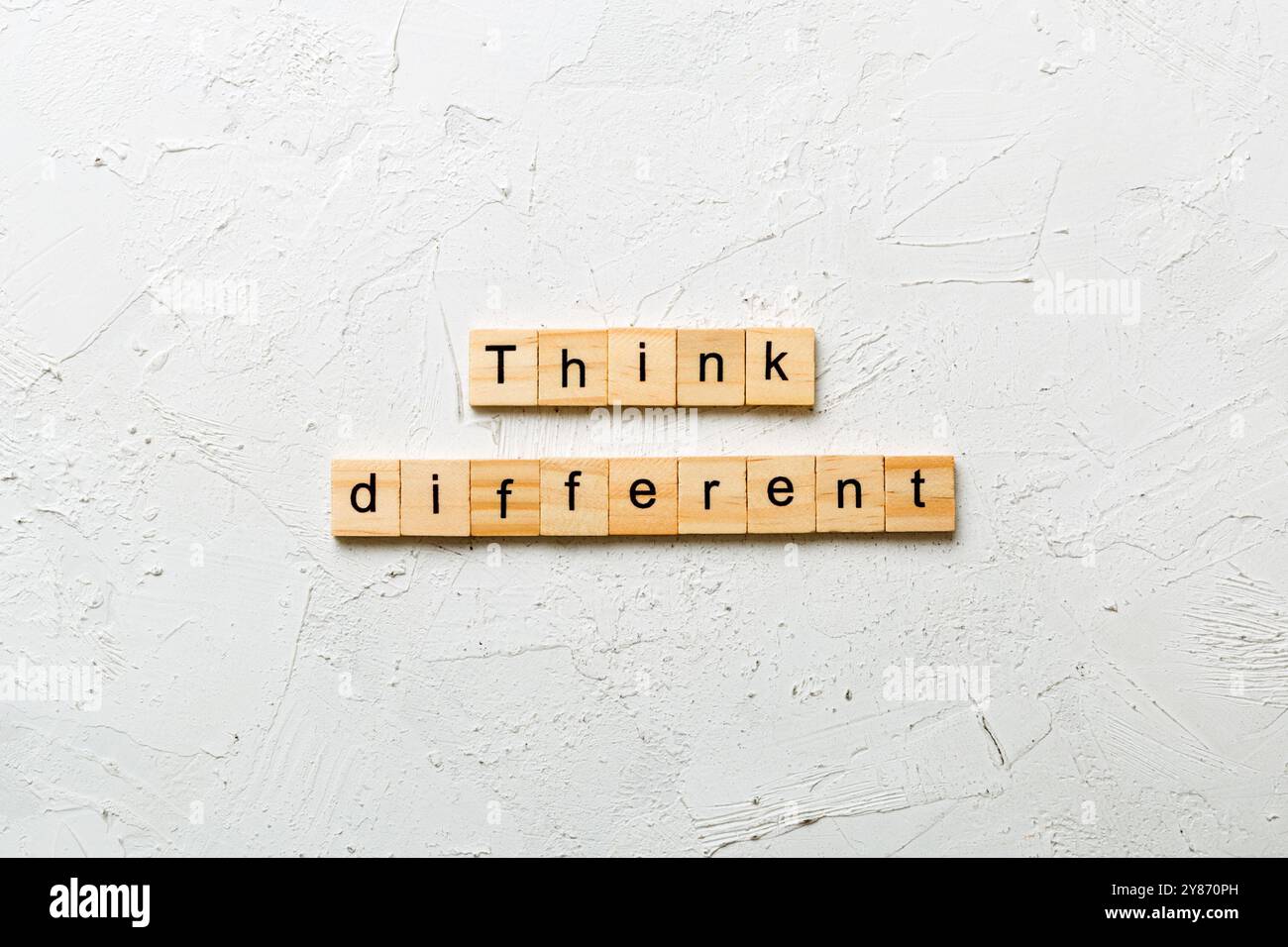 think different word written on wood block. think different text on ...