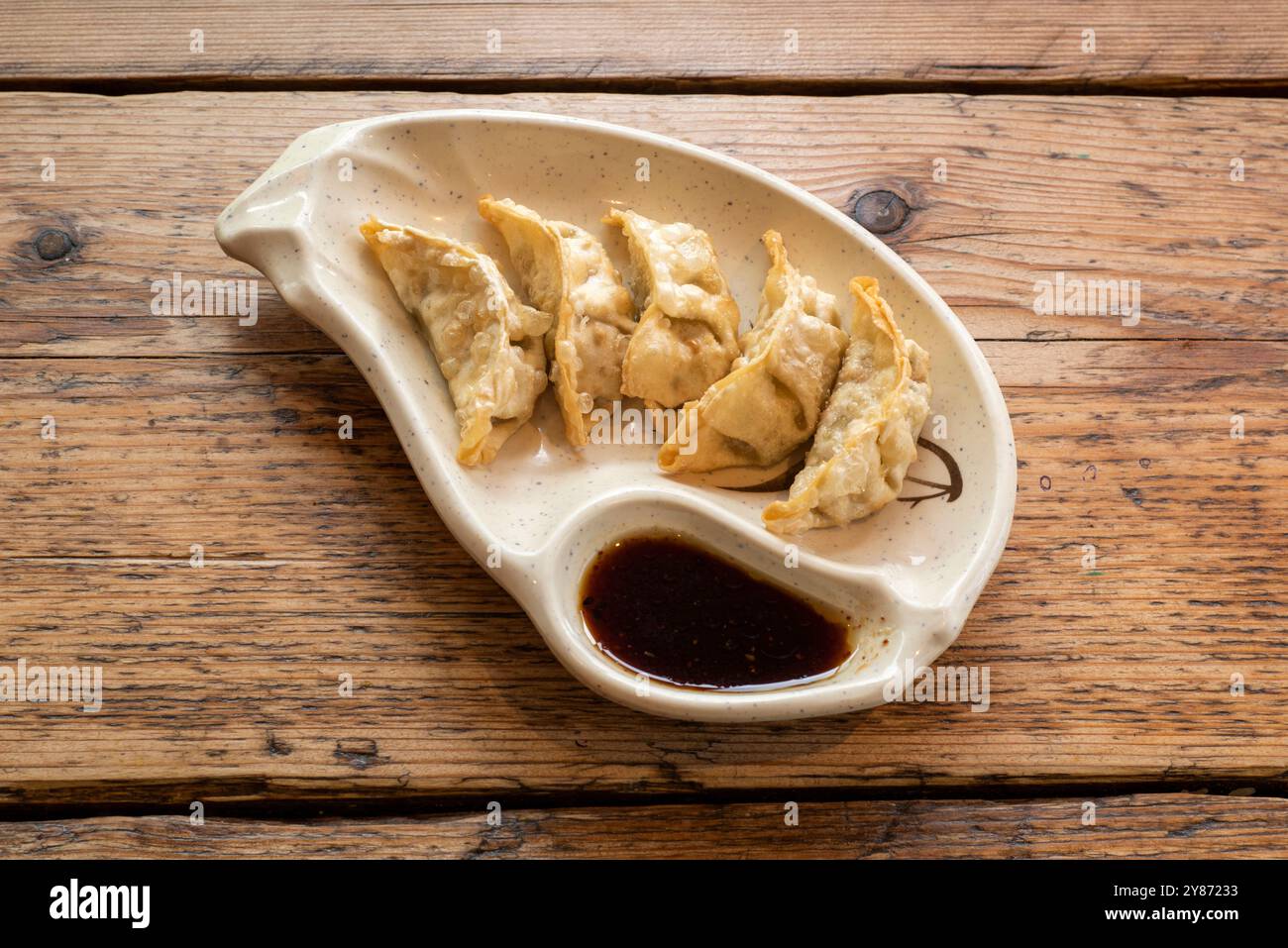 Chinese chicken gyoza dumplings served with a soy sauce dip Stock Photo ...