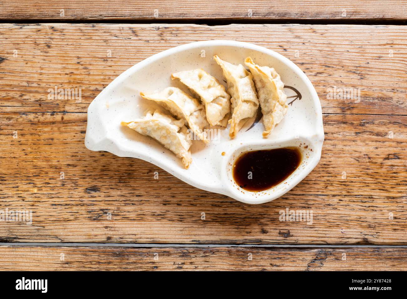 Chinese chicken gyoza dumplings served with a soy sauce dip Stock Photo ...