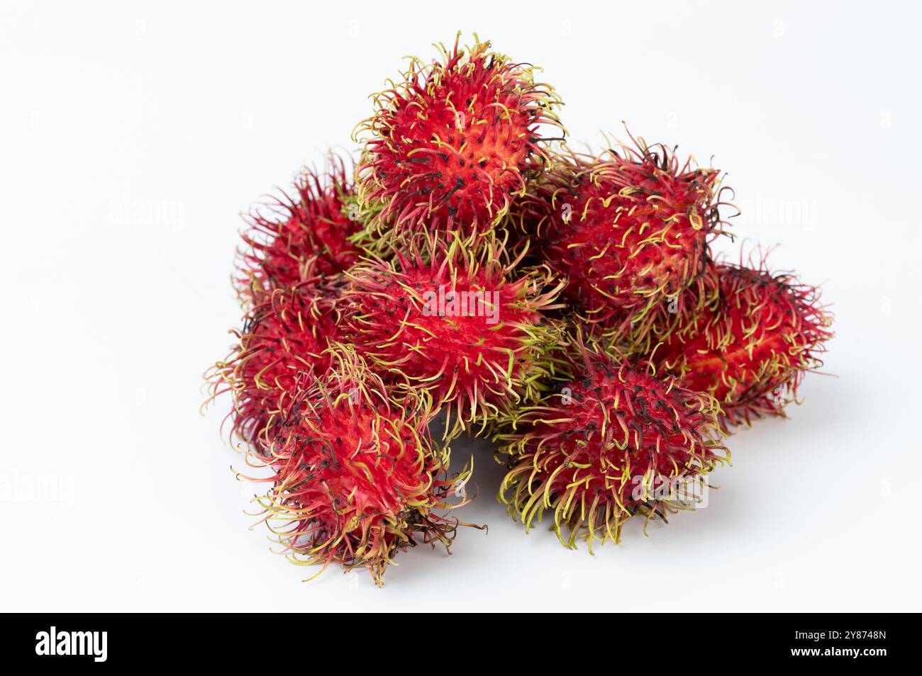 Red hairy tropical fruits rambutan isolated on white studio background ...