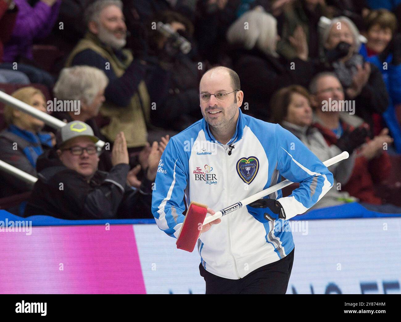 Quebec skip Jean-Michel Menard smiles after defeating Ontario 8-7 in an ...