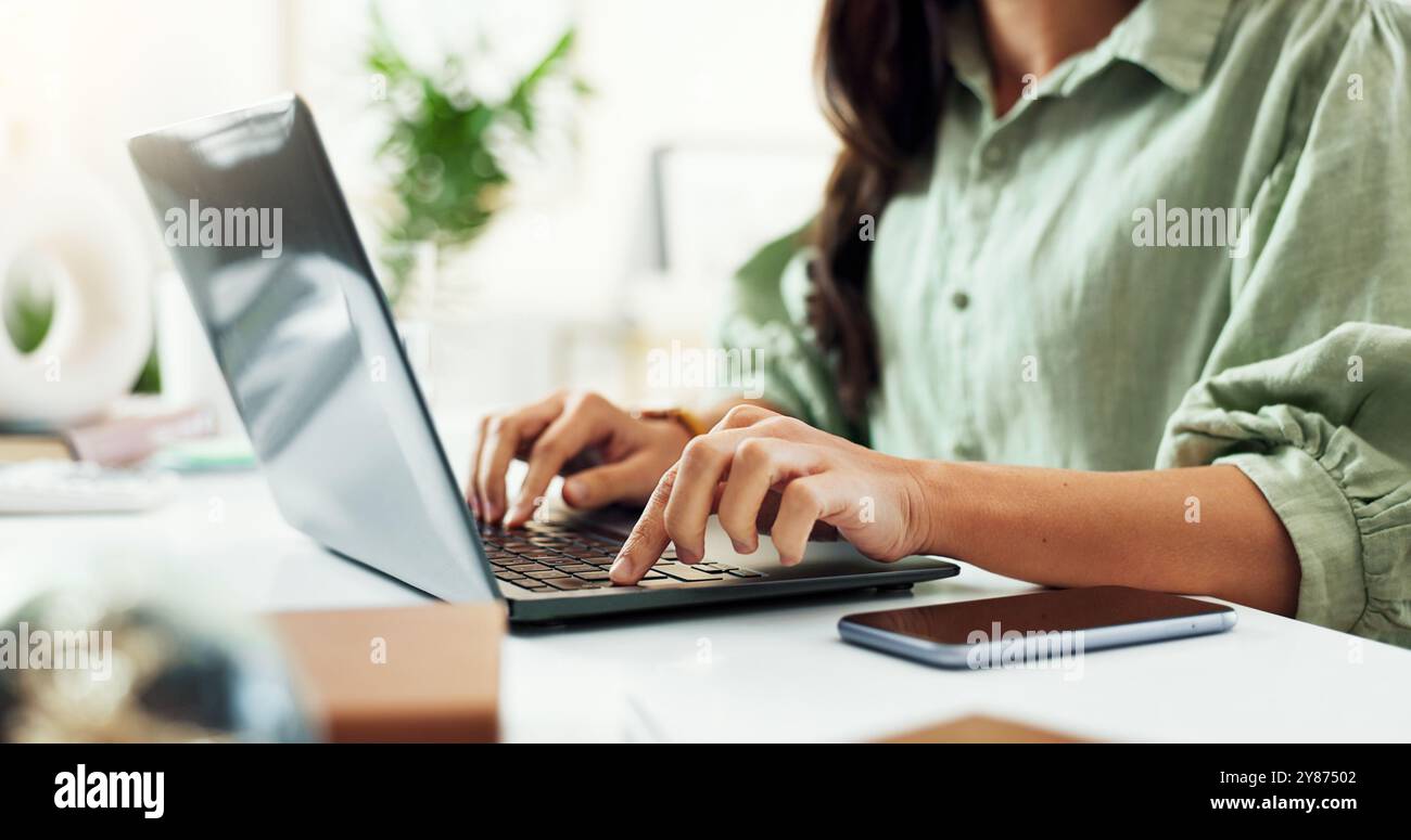 Typing, hands and online with laptop, desk and planning for project ...