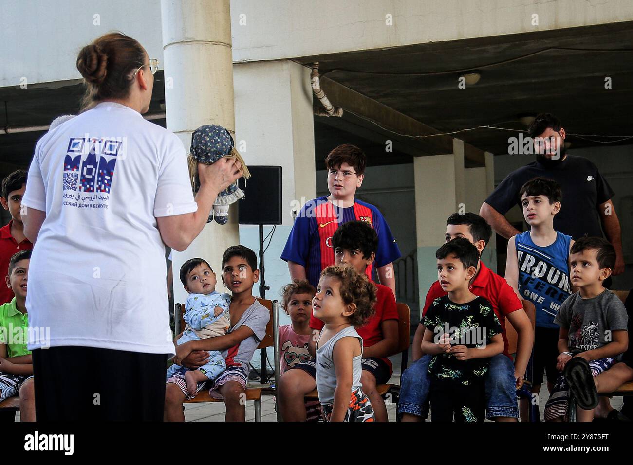 Beirut, Lebanon. 03rd Oct, 2024. Displaced Lebanese children look at a ...