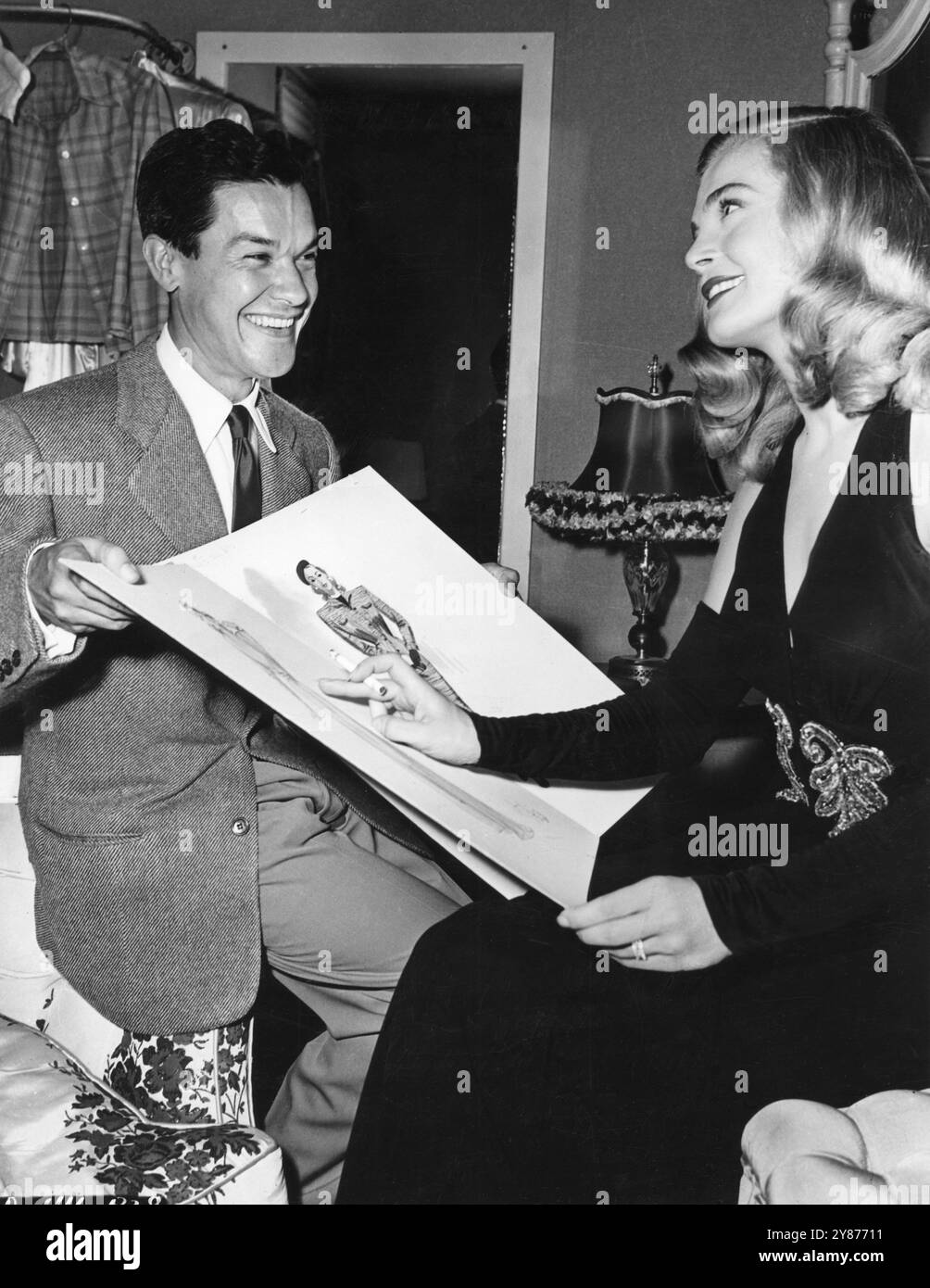 Costume designer JEAN LOUIS and LIZABETH SCOTT in a candid publicity ...
