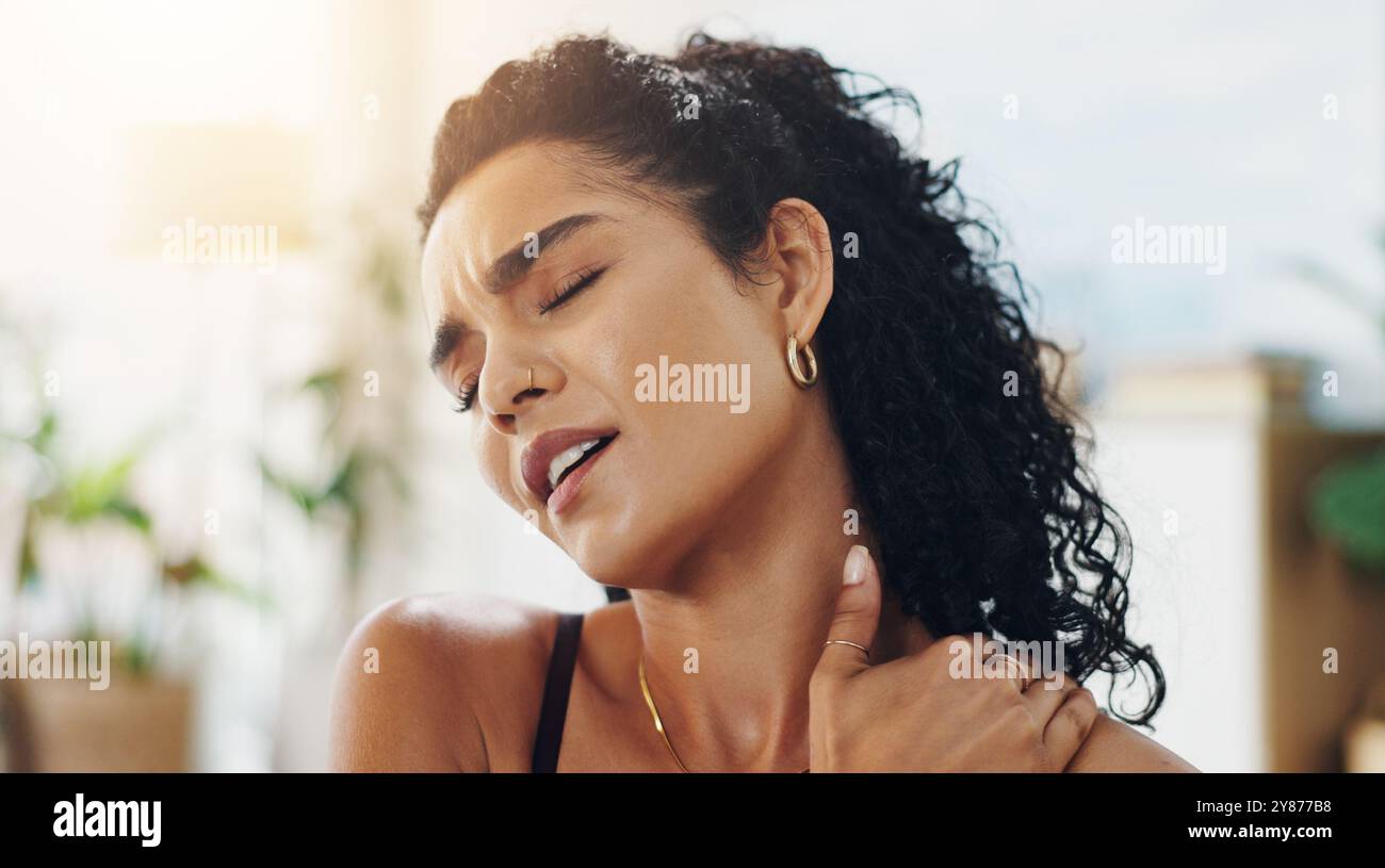 Yoga, shoulder pain and woman in home with injury, muscle strain and ...