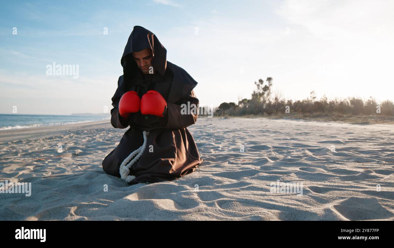 The Boxer Monk Praying With Gloves Stock Photo - Alamy