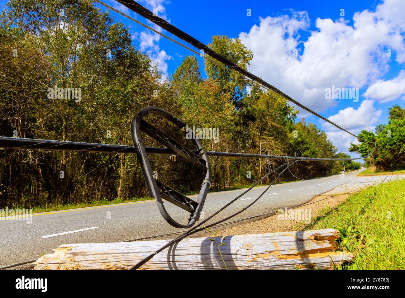 Storm damaged power lines lie broken on ground following hurricane ...