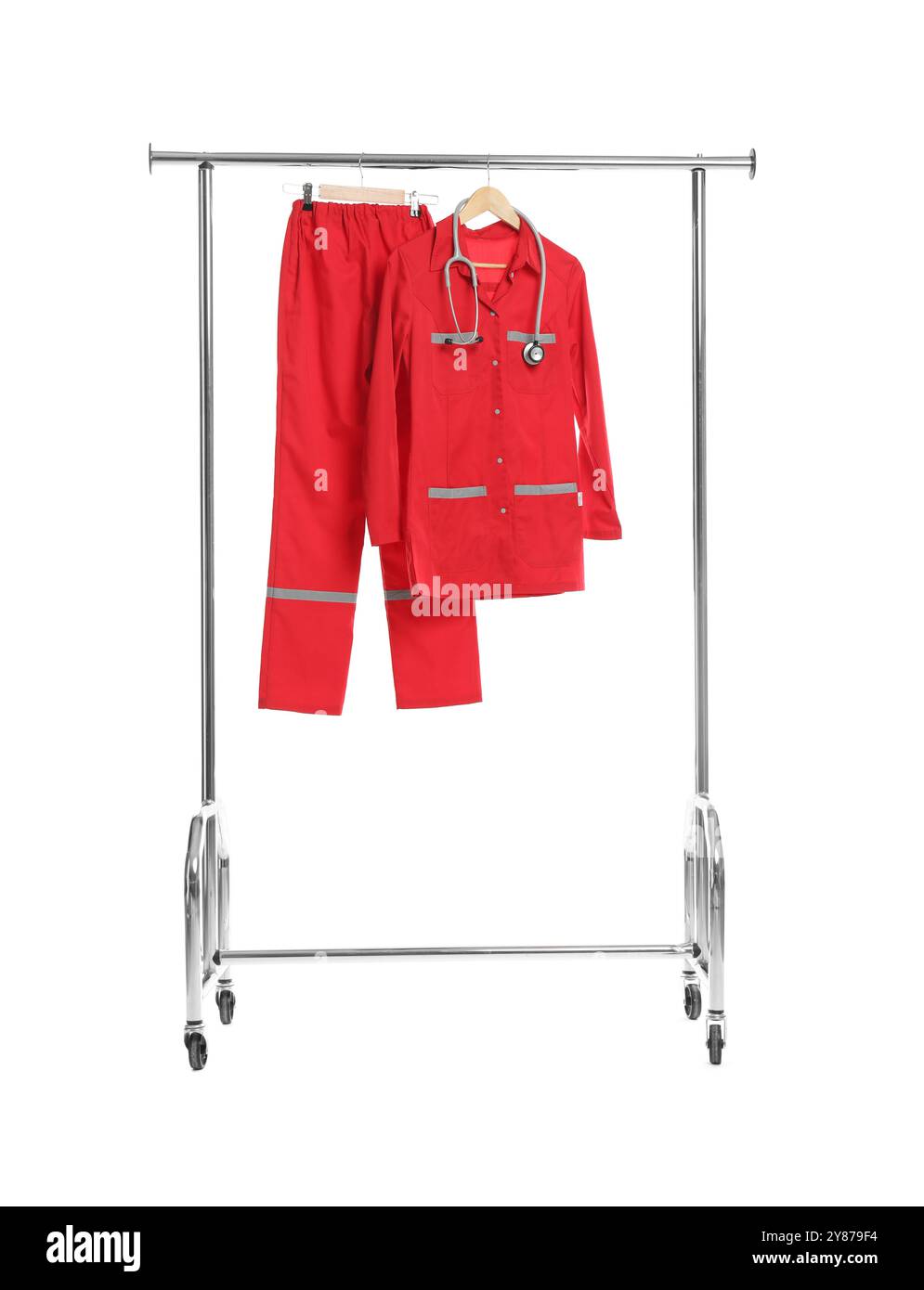 Paramedic uniform with stethoscope on clothing rack against white ...