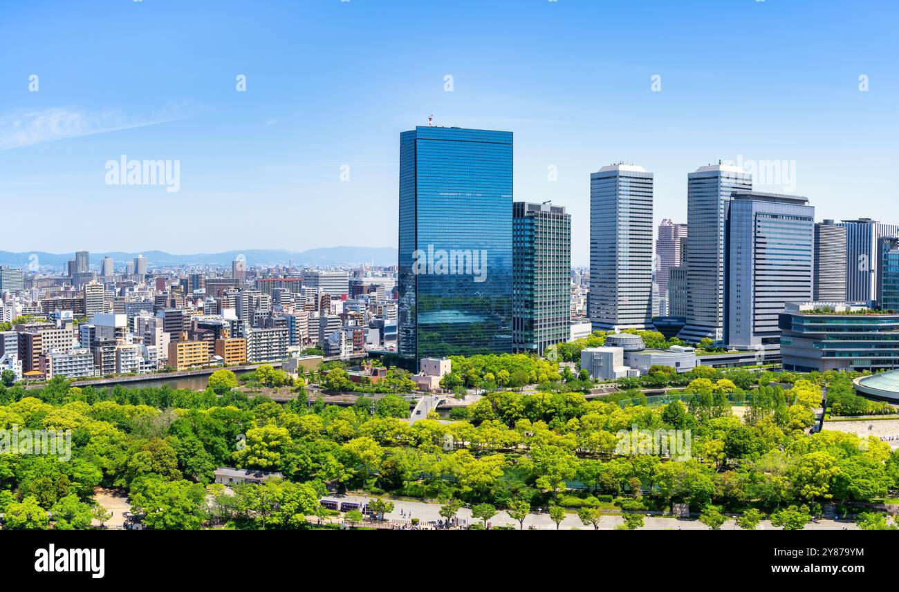 Modern glass skyscrapers seen from the upper floors of Osaka Castle ...