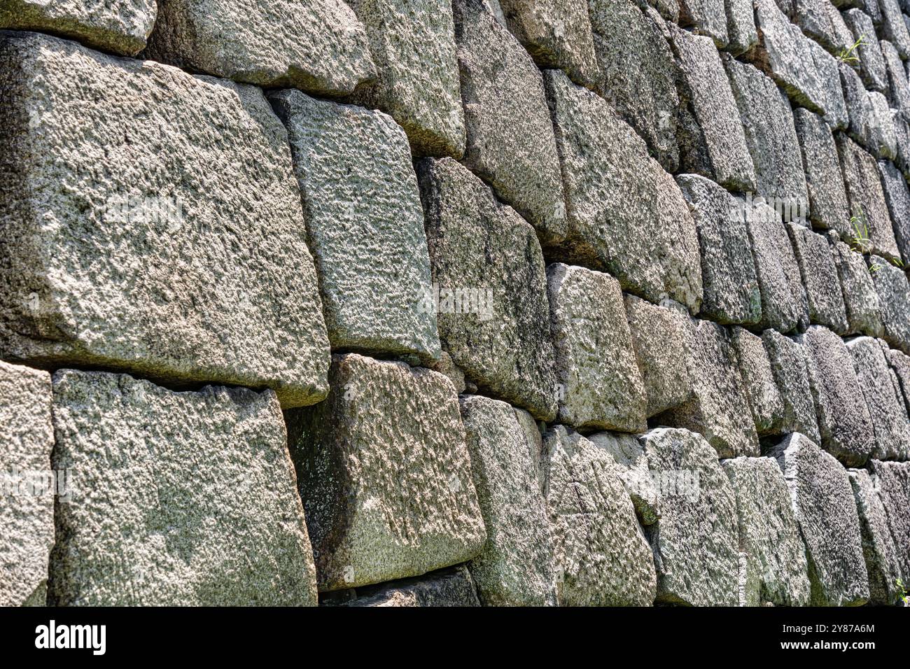 Traditional japanese stone wall moat at the base of Osaka Castle ...